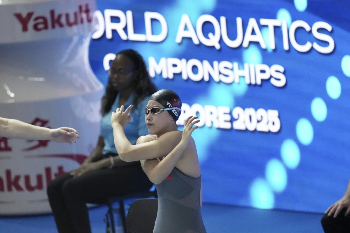 Sin nadar en la Final, Yu Zidi de 12 años hace historia al colgarse el ...